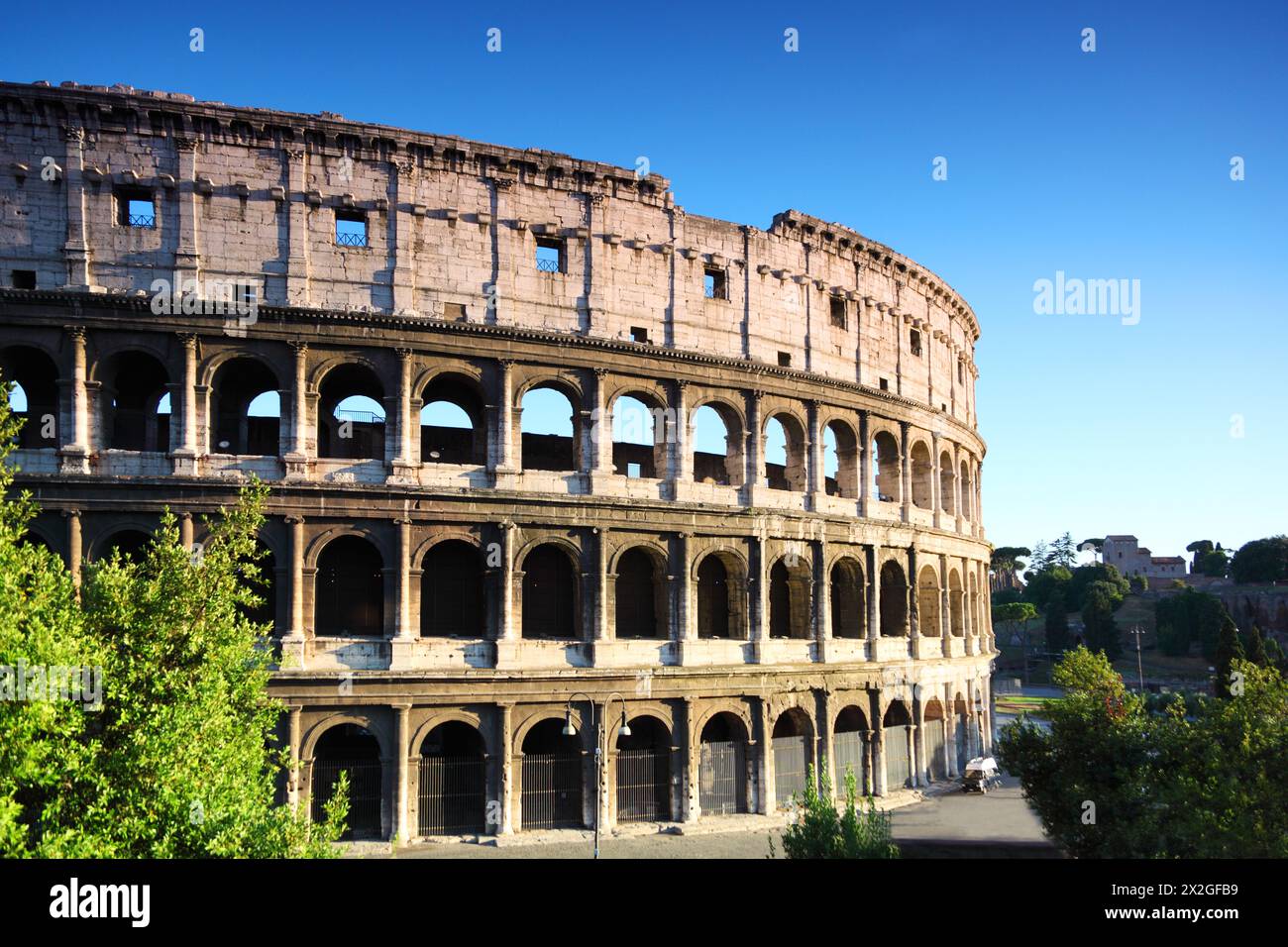 tourists going near old stone walls of Coliseum in Rome, Italy Stock ...