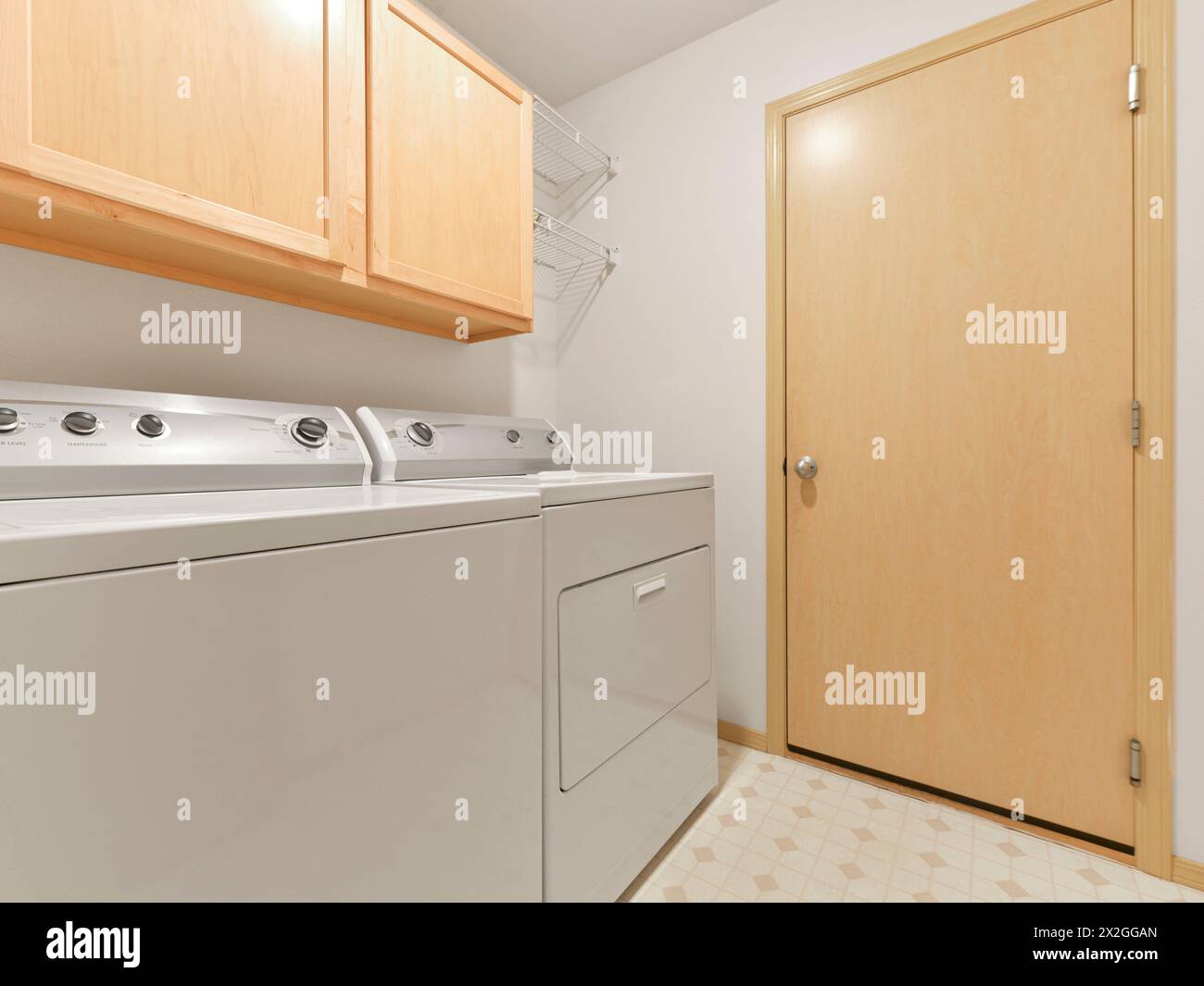 Modern residential laundry room interior Stock Photo - Alamy