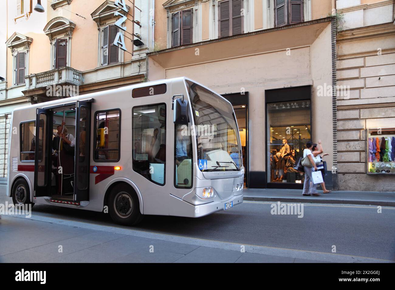 small bus goes on streets of Rome, Italy, old beautiful houses Stock ...