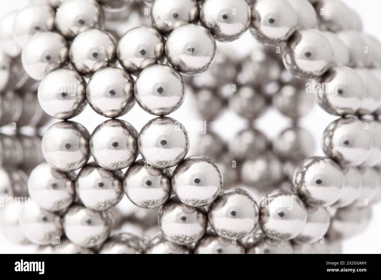 sphere of metal segment assembled from spheres isolated on white Stock ...