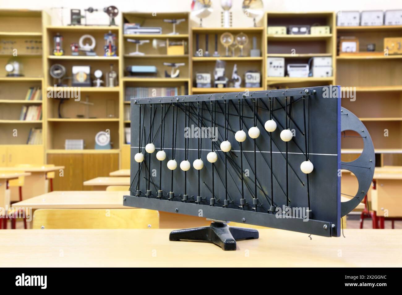 Model of vibration waves on desk in empty physics school class Stock ...