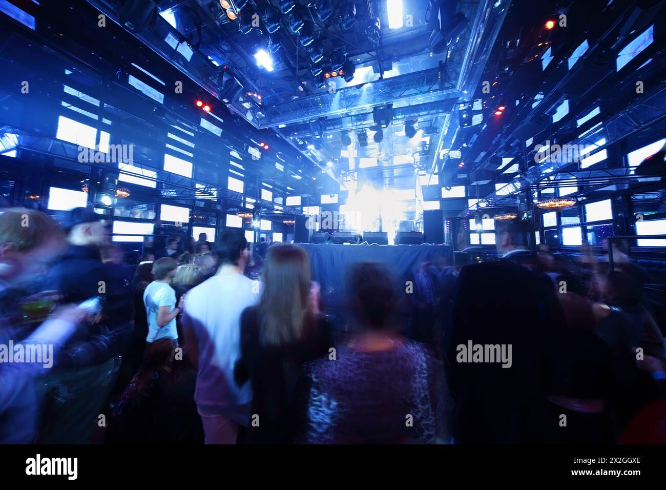 People dancing at concert in nightclub, light show and loud music Stock ...