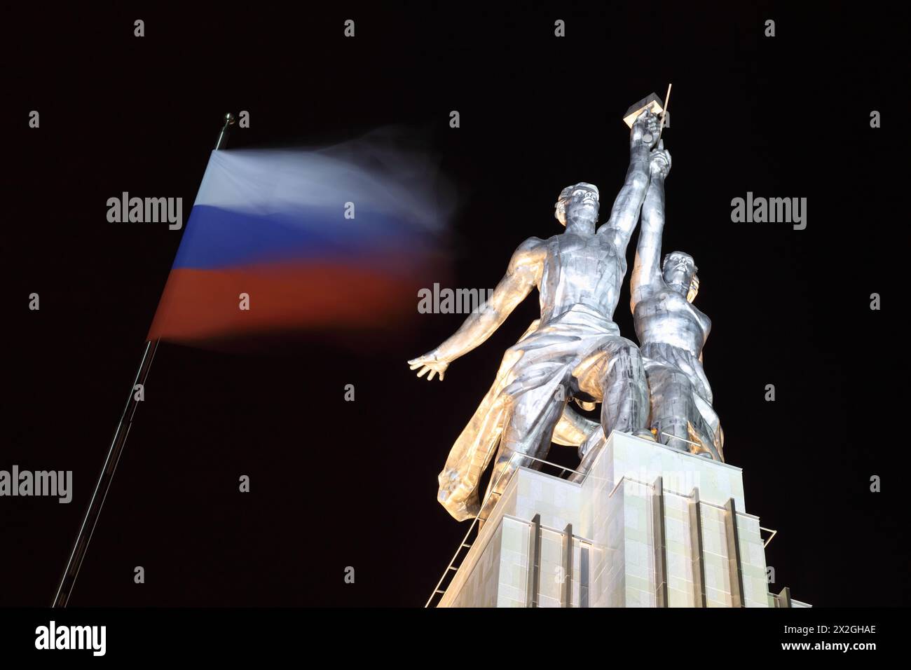 Worker and Collective Farm monument in Moscow at night, hammer and ...
