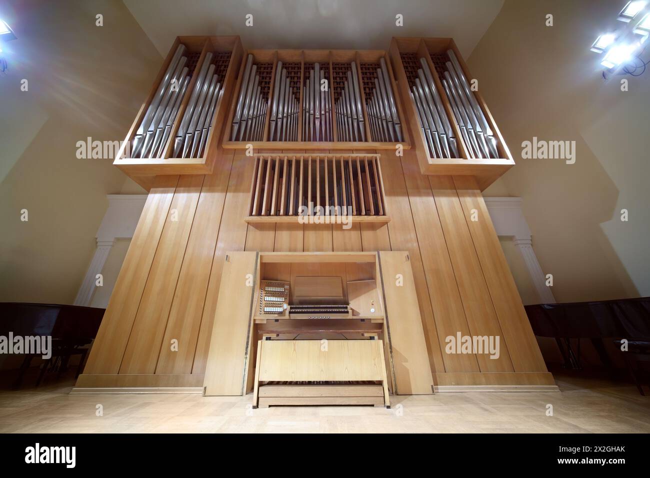 Massive wooden pipe organ with long metal tubes; control panel Stock ...