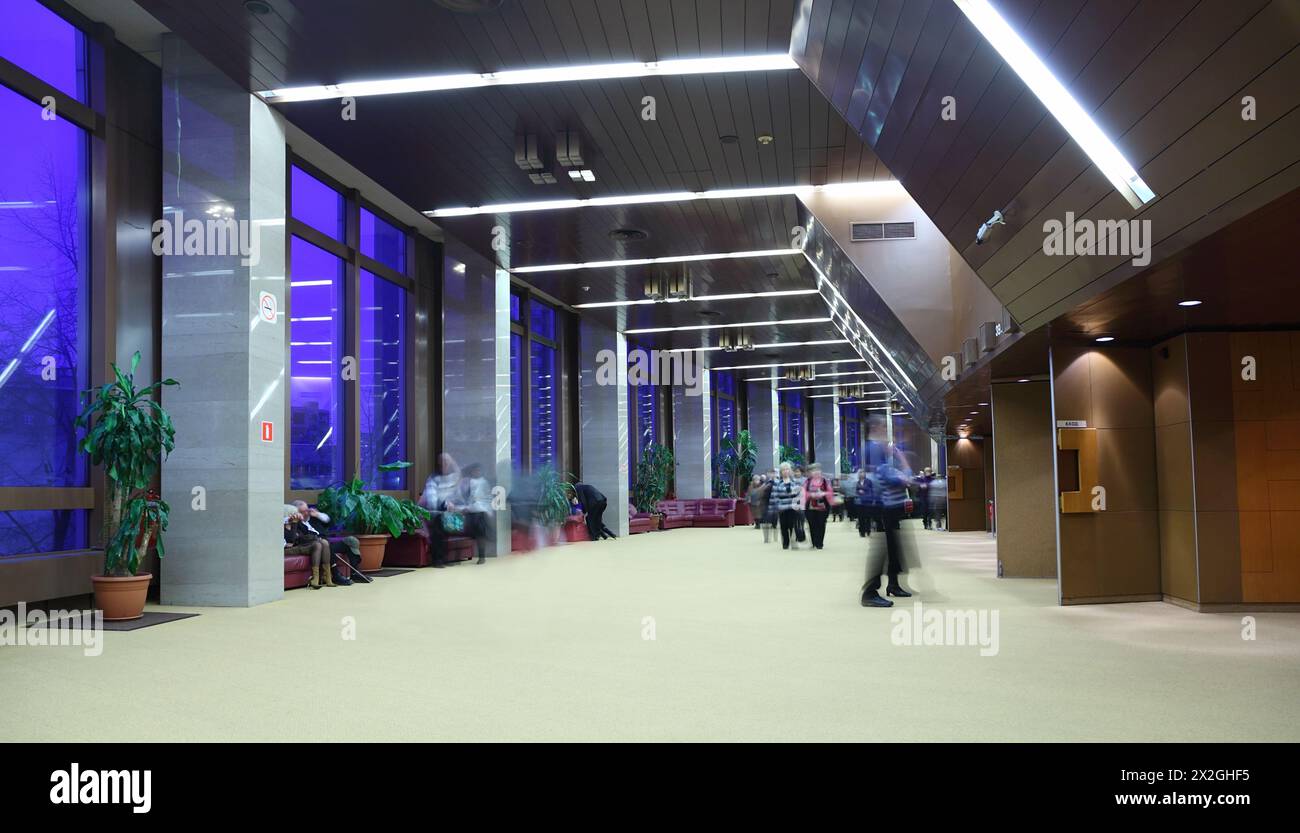 Many people walk in hall hi-res stock photography and images - Alamy