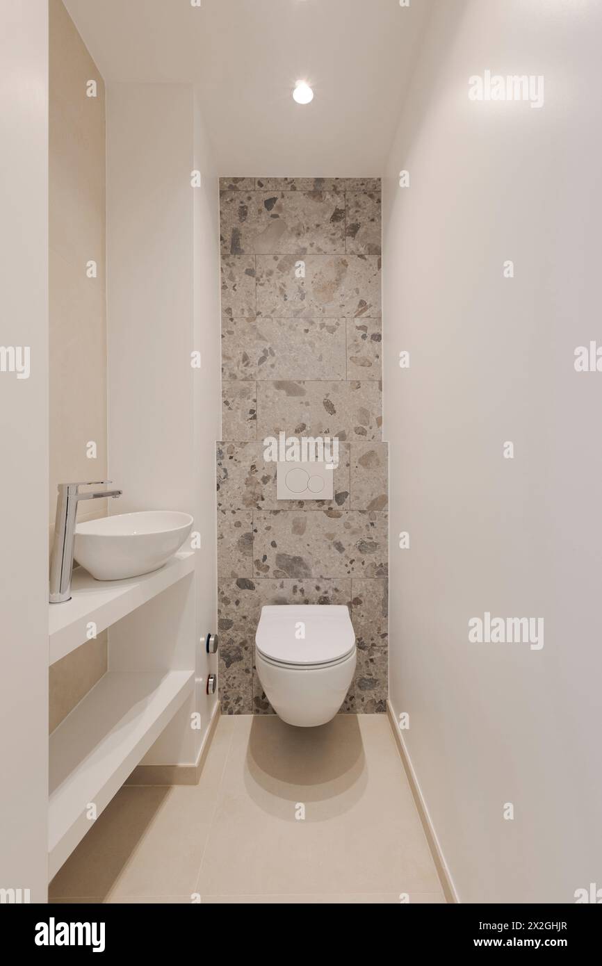 Front view of a very small and narrow toilet Stock Photo - Alamy