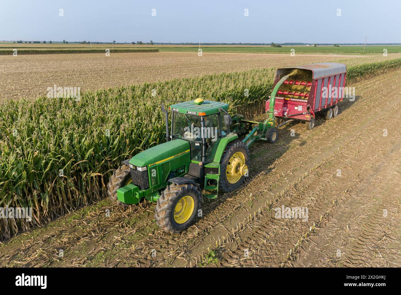63801-24201 Aerial view of farmer cutting corn silage for cattle feed ...