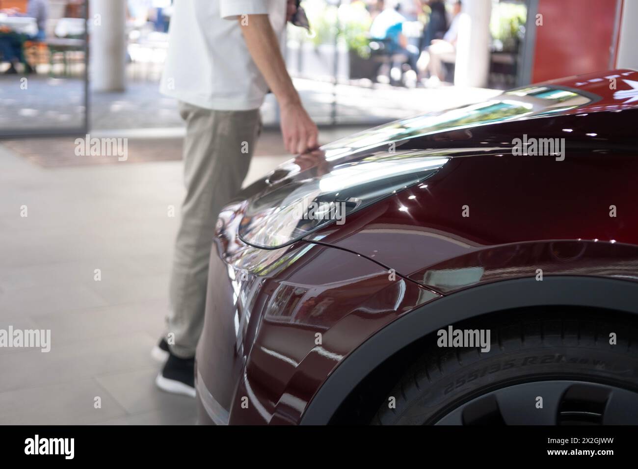 Tesla car model Y in cherry red color in Studio, electric vehicle in ...