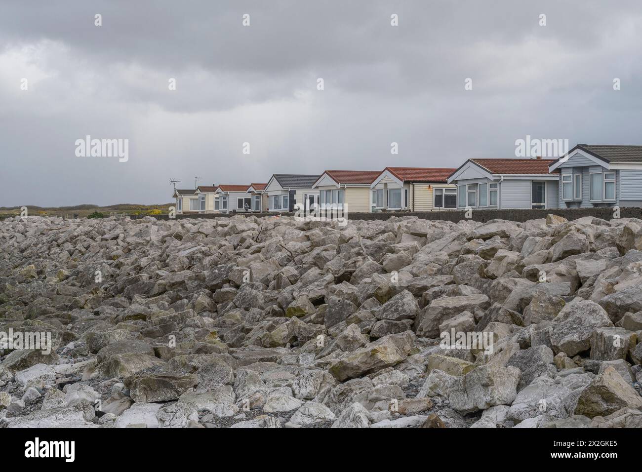 Bungalows near the seafront behind sea defence rocks, West Shore ...