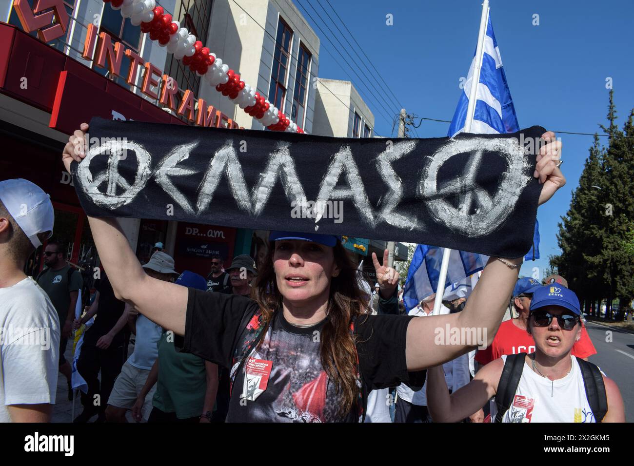 Athens, Greece. 21 April 2024. A Peace Marathon protestor marches ...