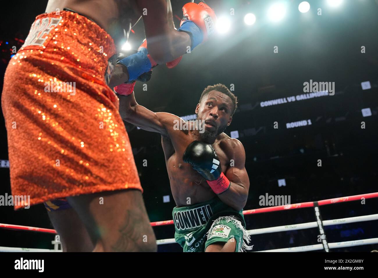 Charles Conwell, right, punches Nathaniel Gallimore during the first round of a super ...