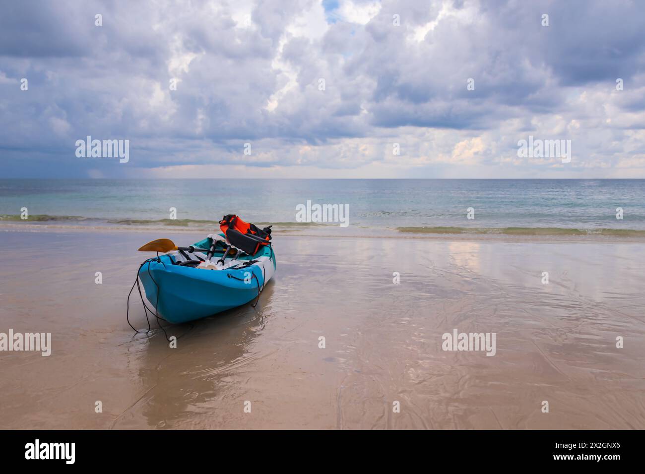 Canoe on the tropical beach and sea in midday before rainy Stock Photo ...