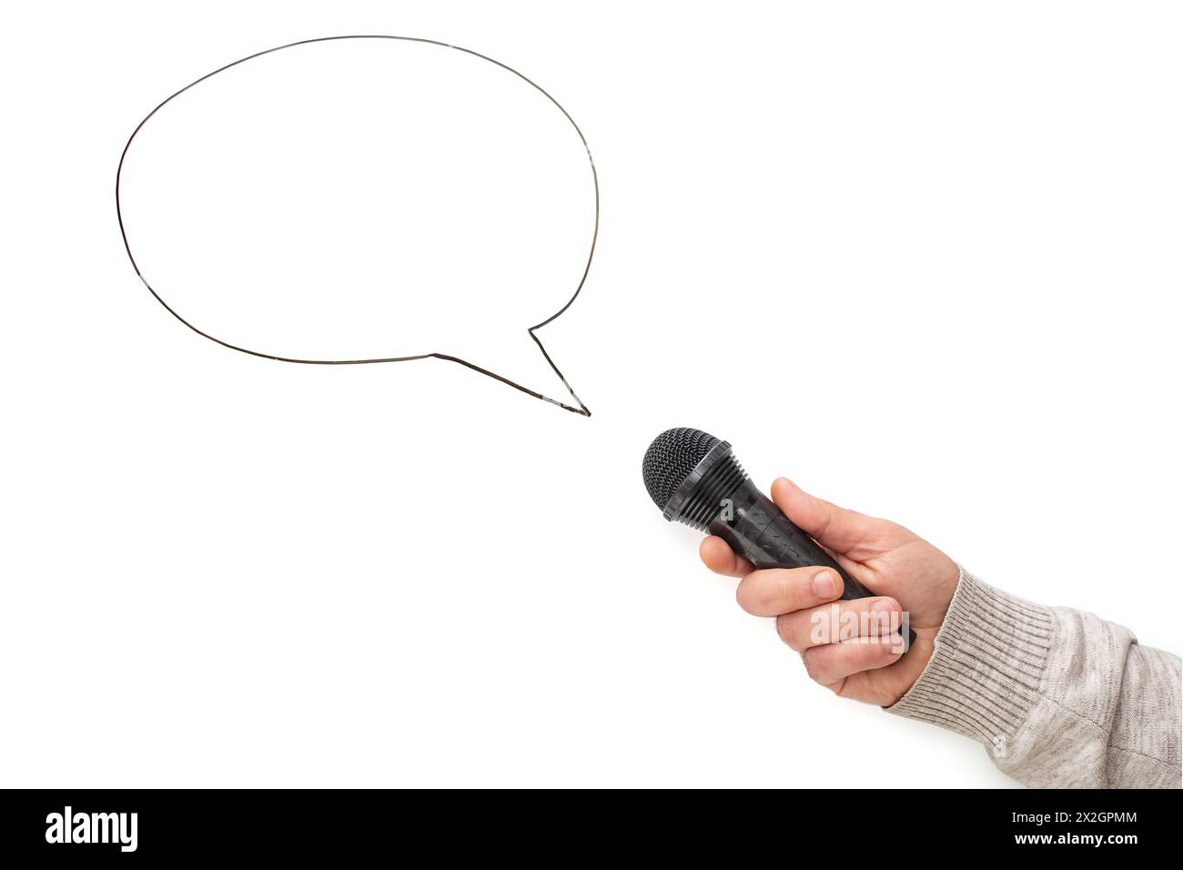 Male arm holding a black microphone next to a speech bubble, isolated ...