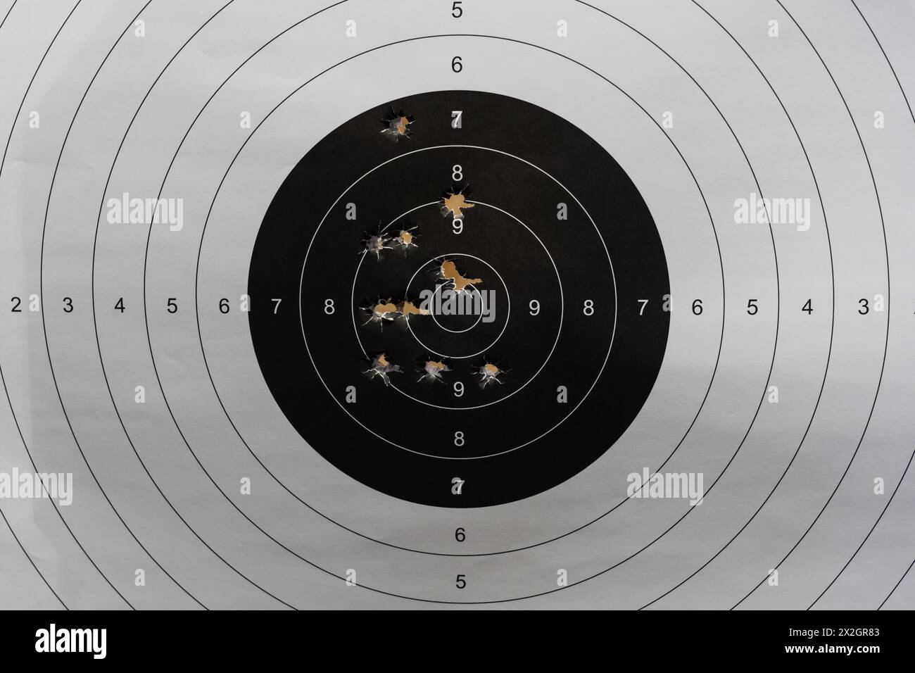 Paper target for shooting with holes from 45 caliber pistol bullets ...
