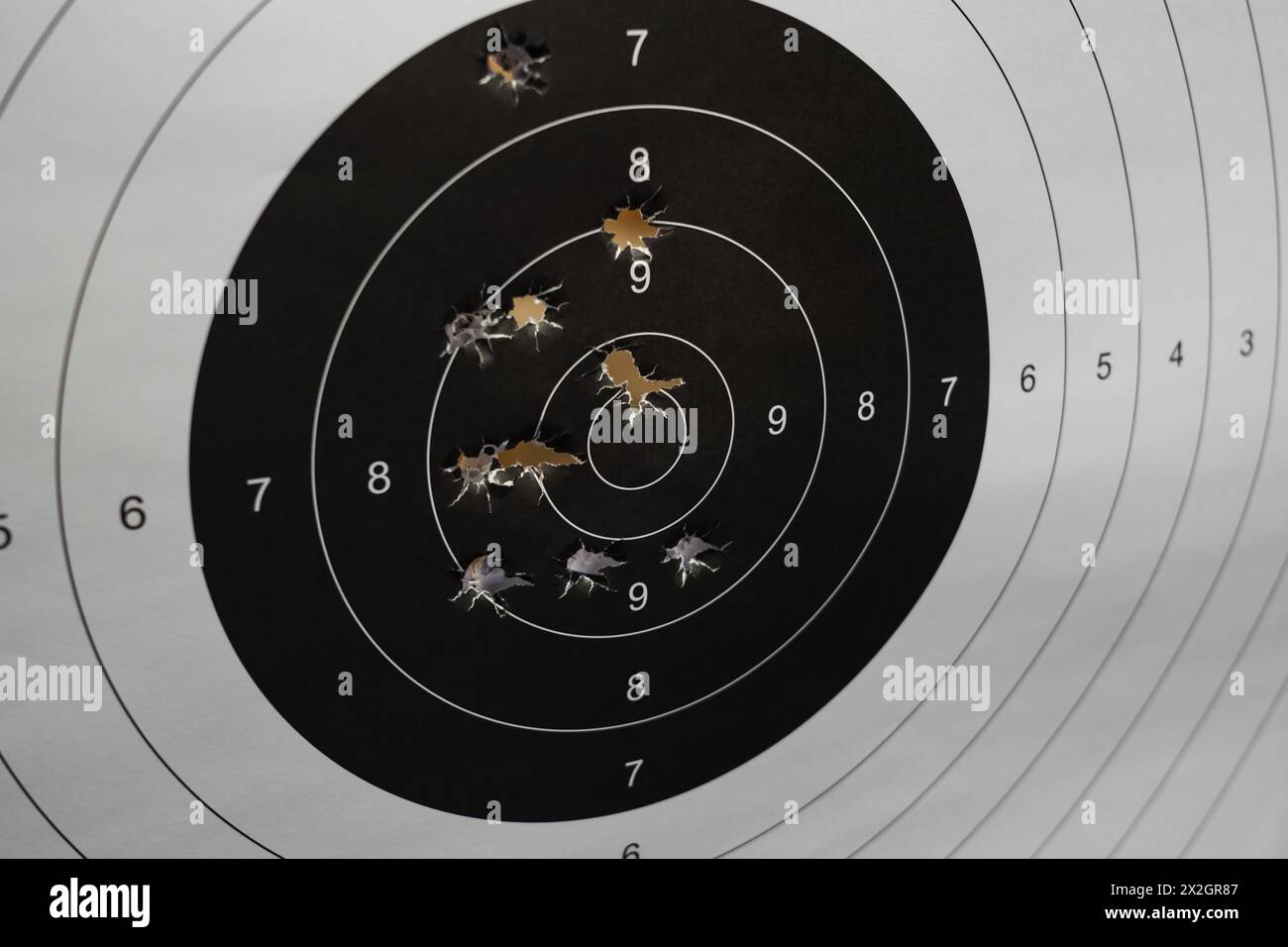 Paper target for shooting with holes from 45 caliber pistol bullets ...