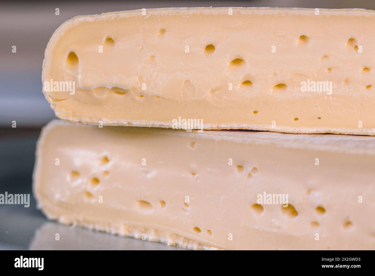 Soft ripend cow's milk cheeses with eyes Stock Photo - Alamy