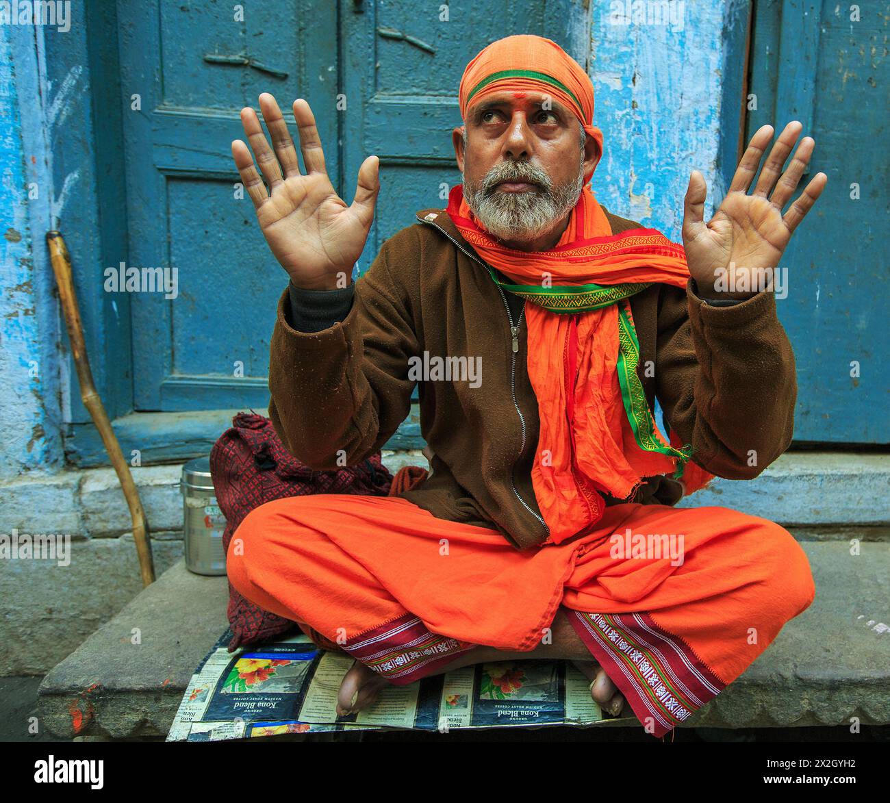 Sadhu or spiritual aspirant sitting in the lotus position with hands ...