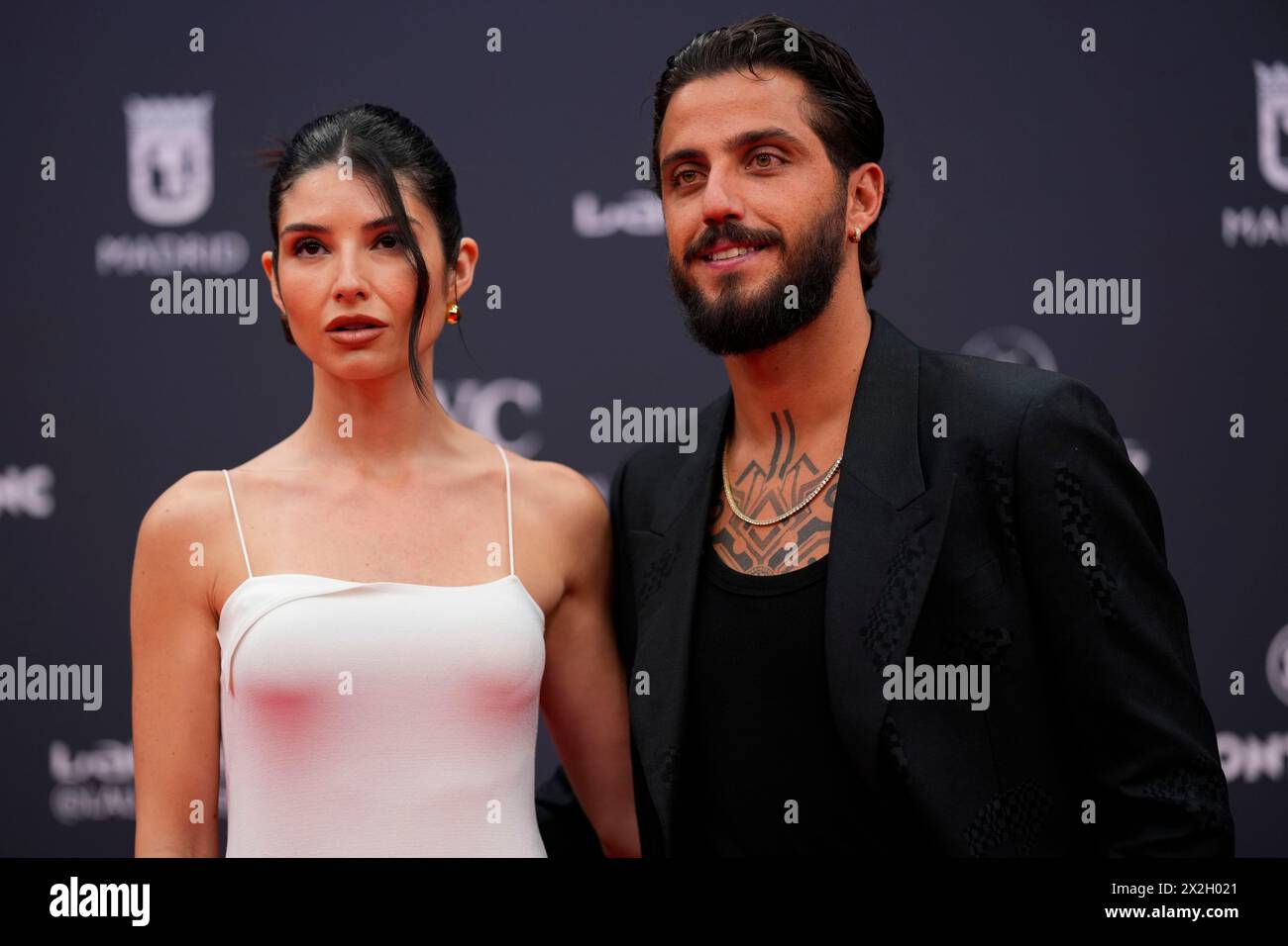 Brazilian surfer Filipe Toledo, right, and singer Ananda Marcal pose at ...