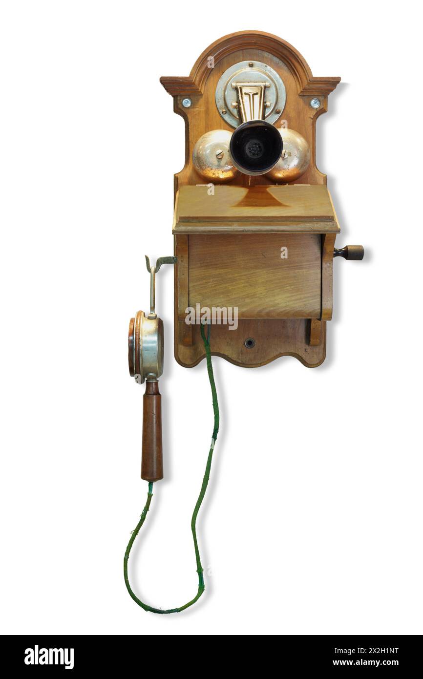 Wall mounted telephone with magneto call Stock Photo - Alamy