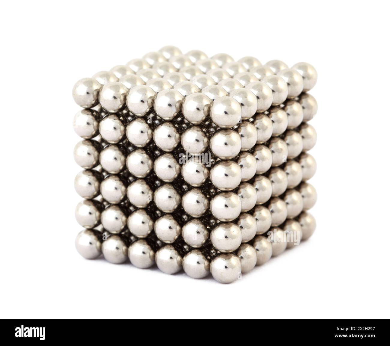 Cube assembled from little metallic magnetic balls isolated on white ...