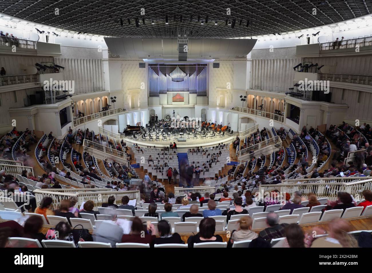MOSCOW - FEBRUARY 26: People are seats in hall before concert of ...