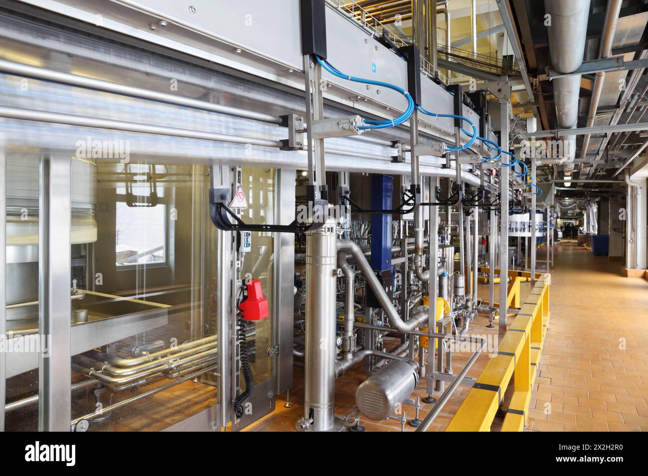 Lots of different interlocking metal pipes and reservoirs in lit ...