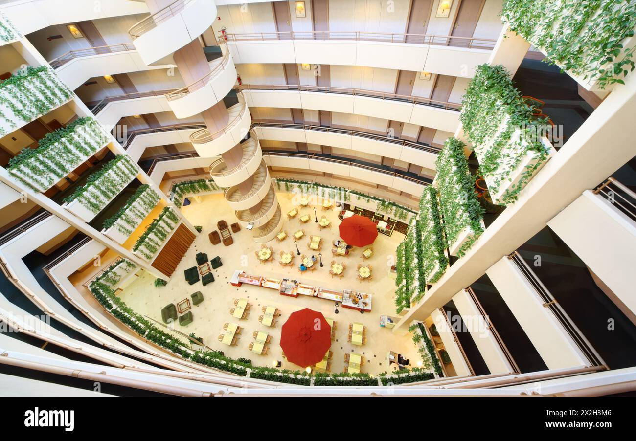 Stories in hotel, spiral staircase connects all floors; restaurant ...