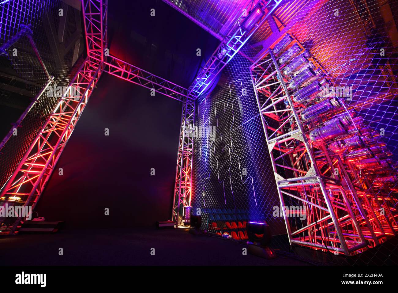 Colorful illuminated way with grid to boxing ring inside fight club ...