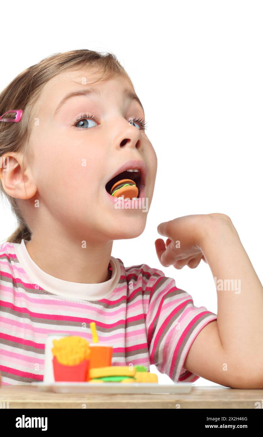 beautiful little girl eating toy burger, toy cola and hamburger on ...