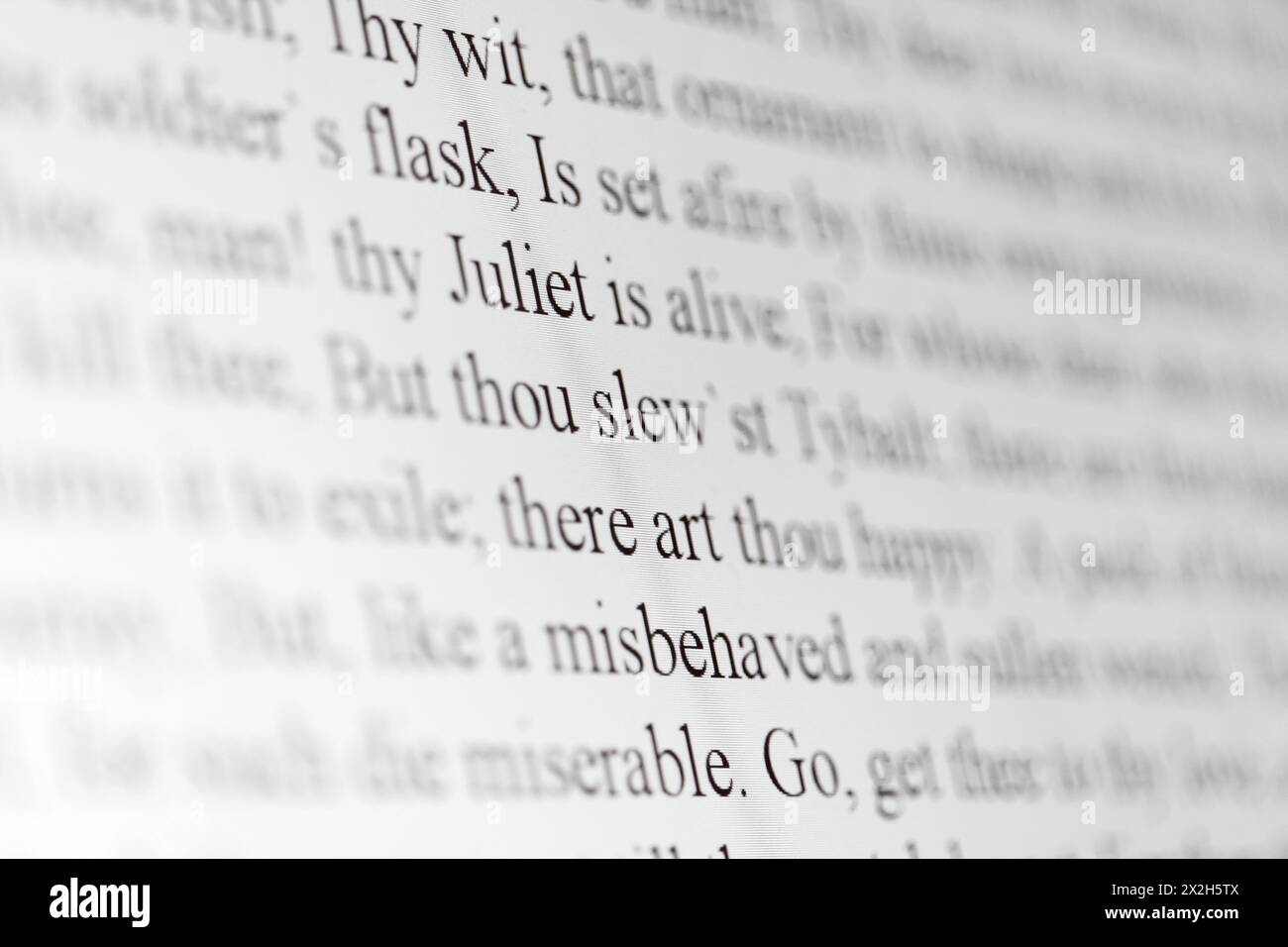 Text of Shakespeare drama Romeo and Juliet on black and white display ...