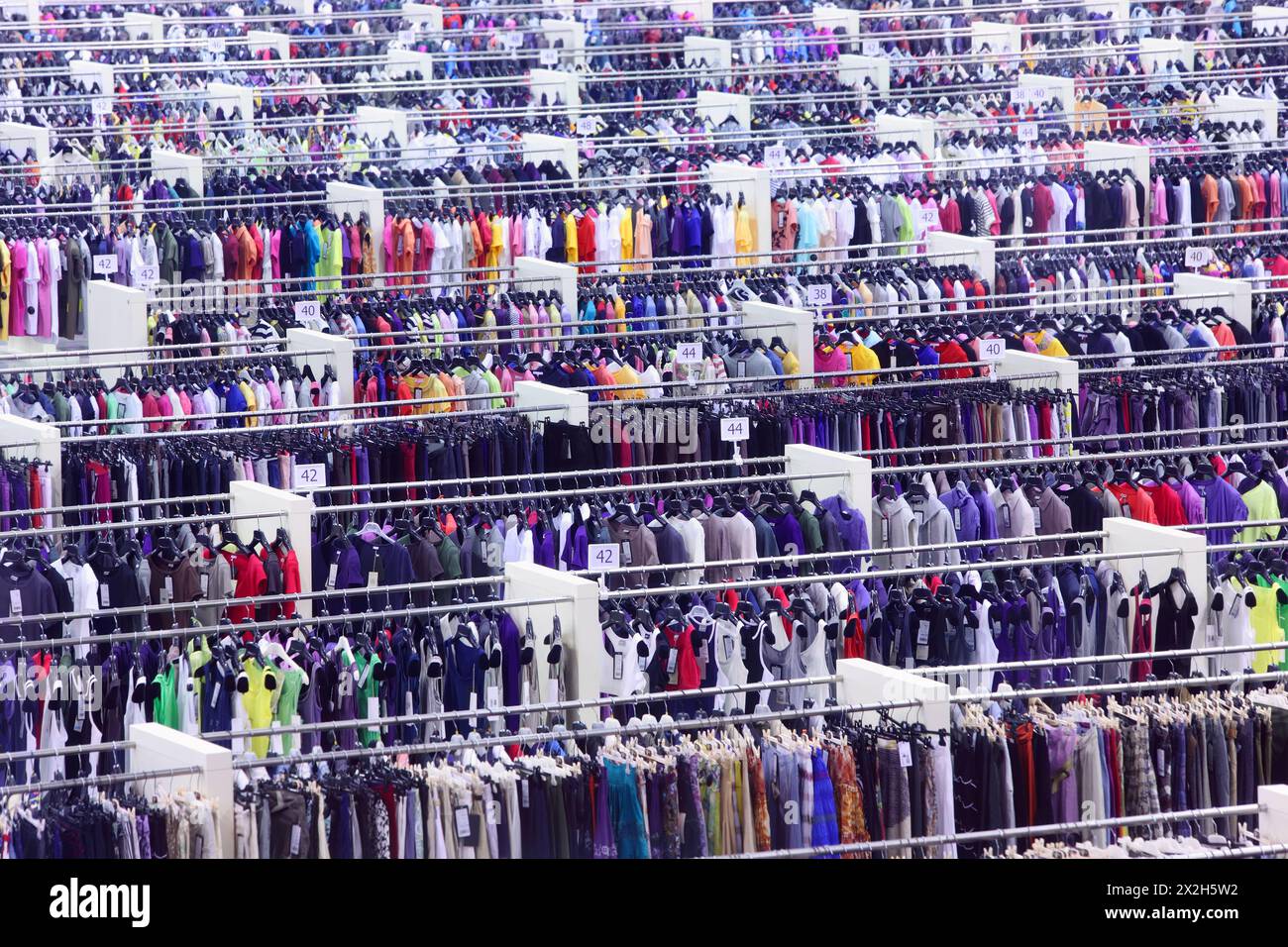 Large clothing store, many rows with hangers, variety of sizes Stock ...