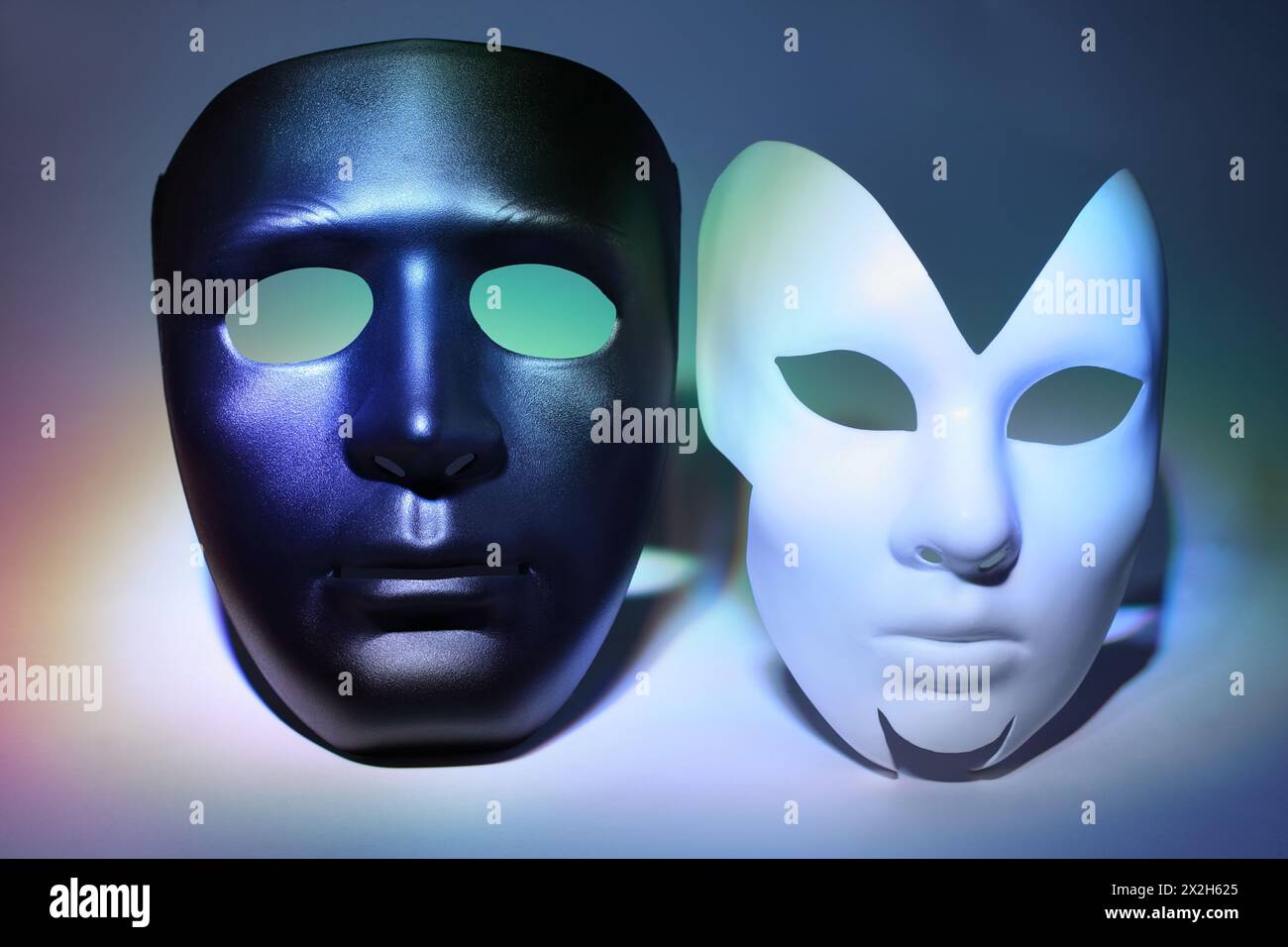 simple white serious and black masks (man and woman), which is colorful ...