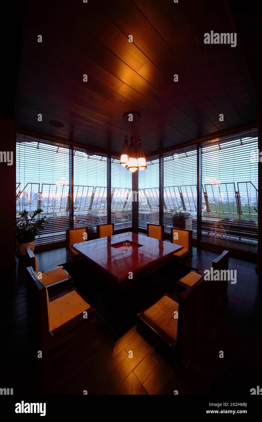 square table in deepening of floor and chairs in empty comfortable ...