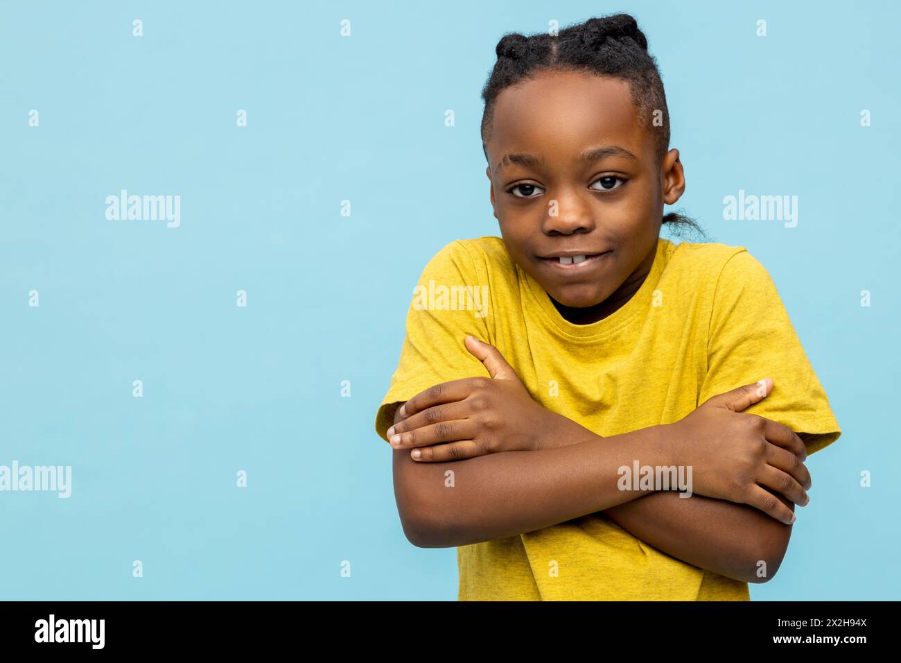 Cute dark- skinned little boy feeling cold a Stock Photo - Alamy