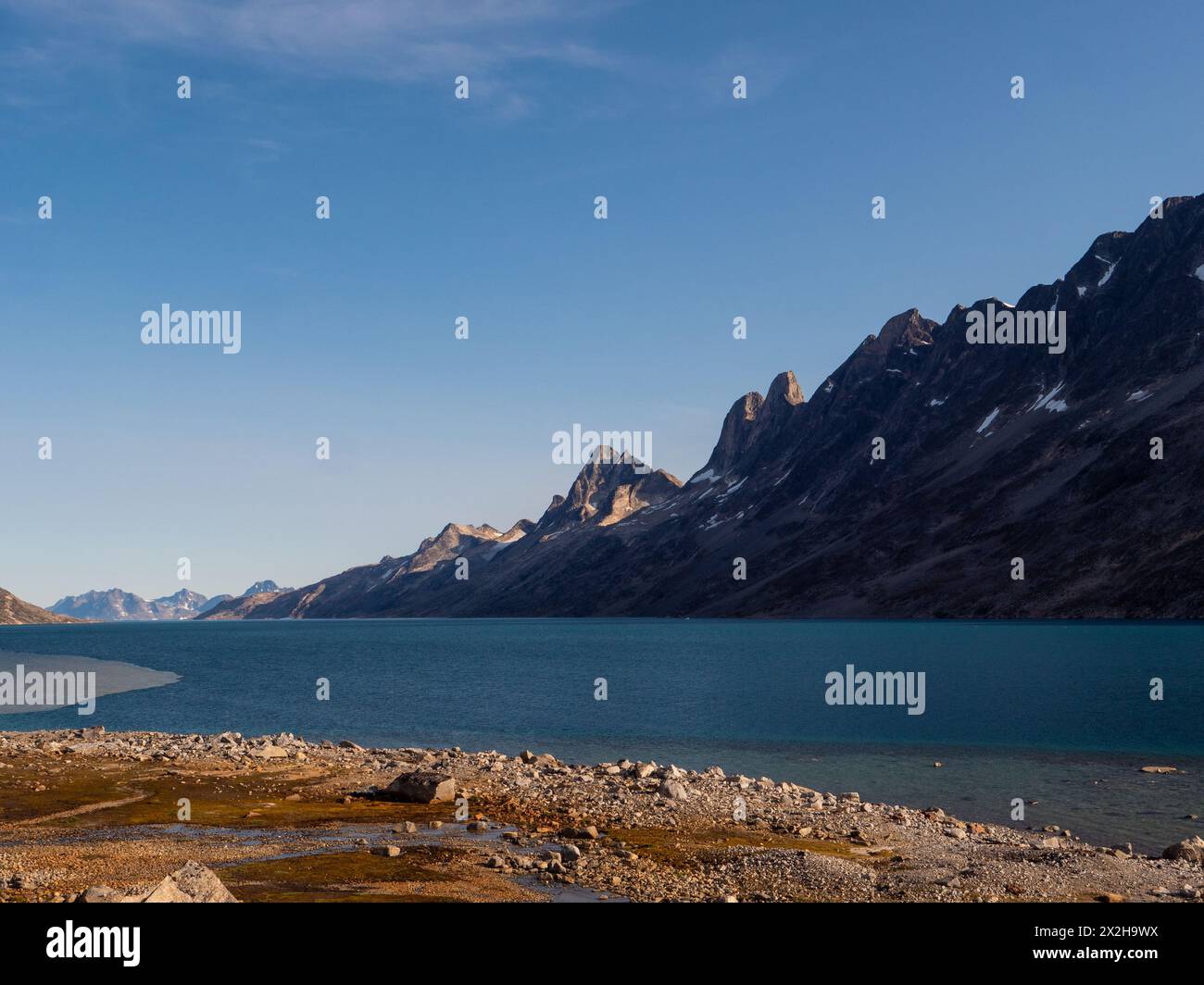 Mountain range at Ikaasatsivaq Fjord in East Greenland Stock Photo - Alamy