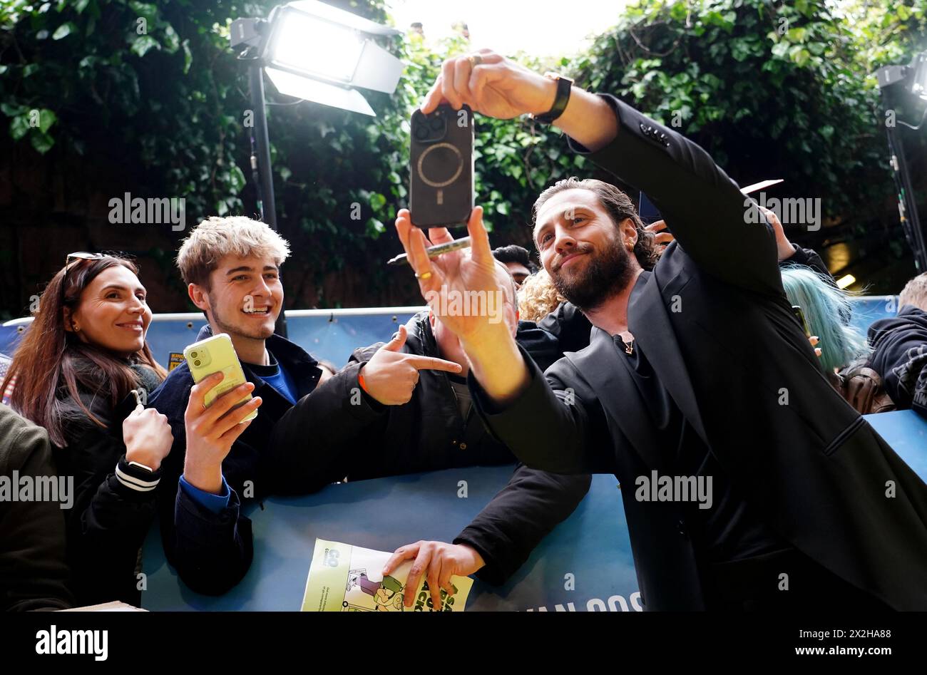 Aaron Taylor-Johnson takes a photo with fans while attending a special ...