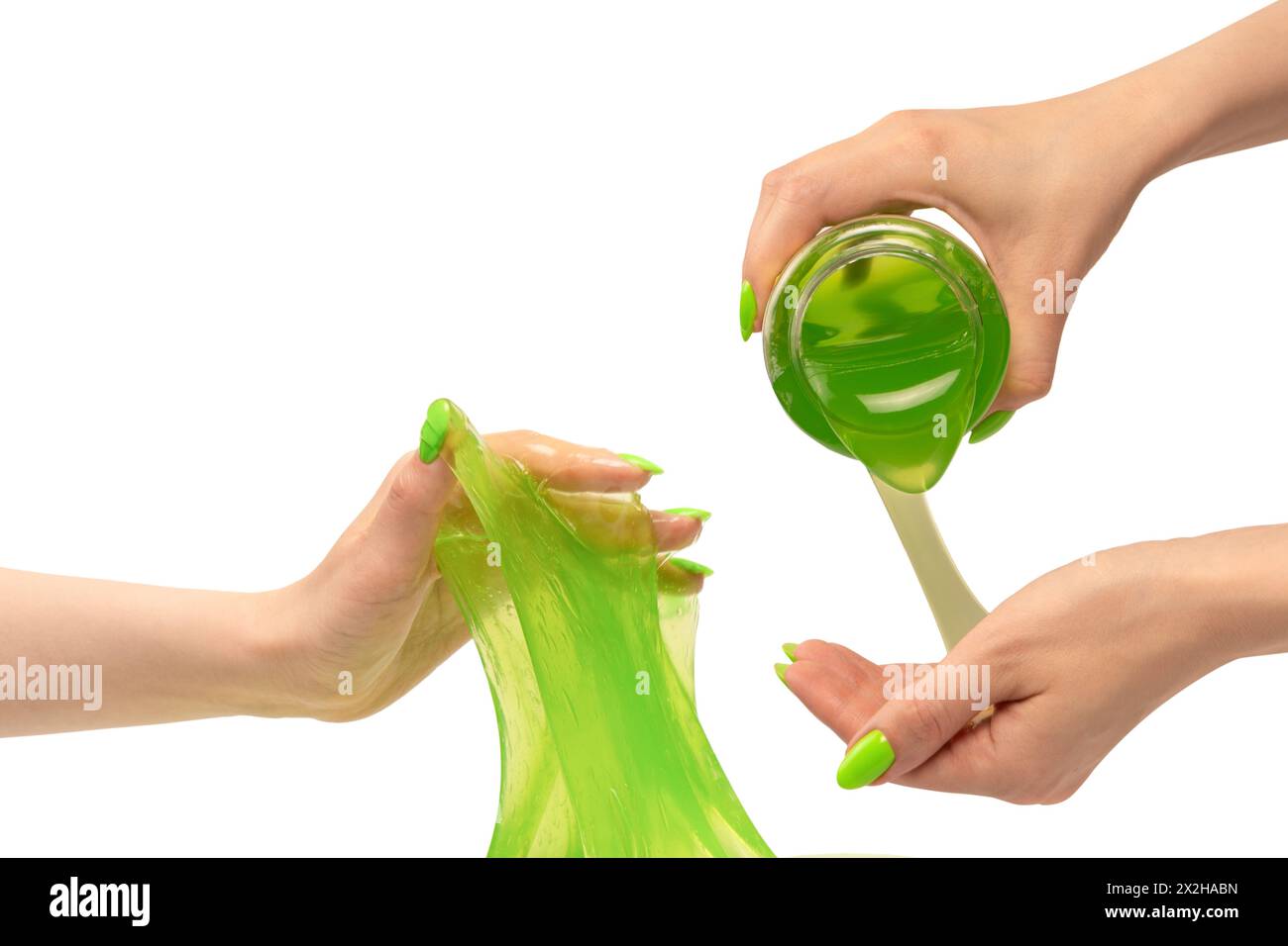 Green slime toy in woman hand with green nails isolated on a white ...