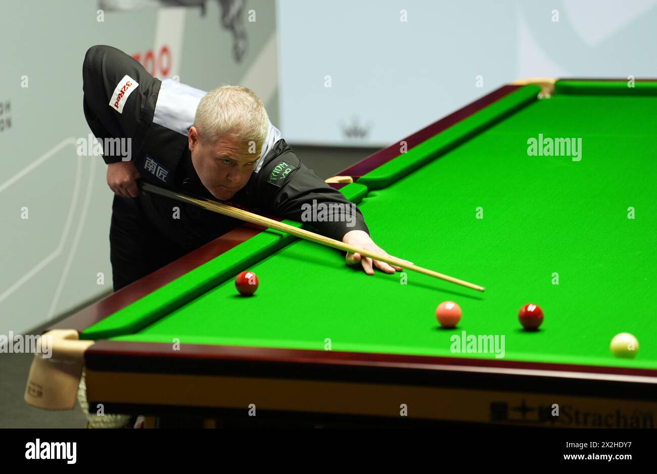 Robert Milkins in action against Pang Junxu on day three of the 2024 ...