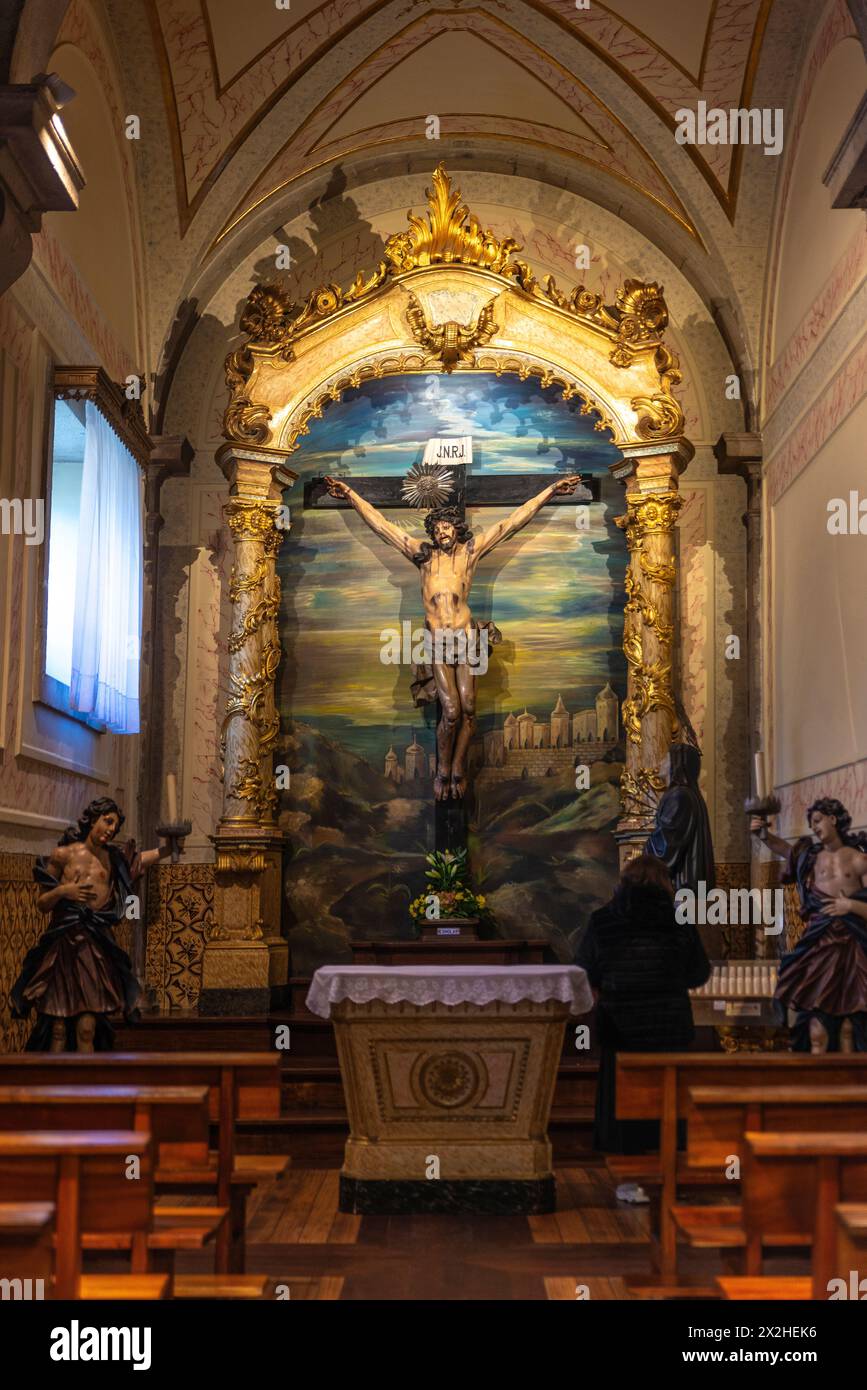 Altar with the crucifixion of Jesus Christ in the interior of the ...