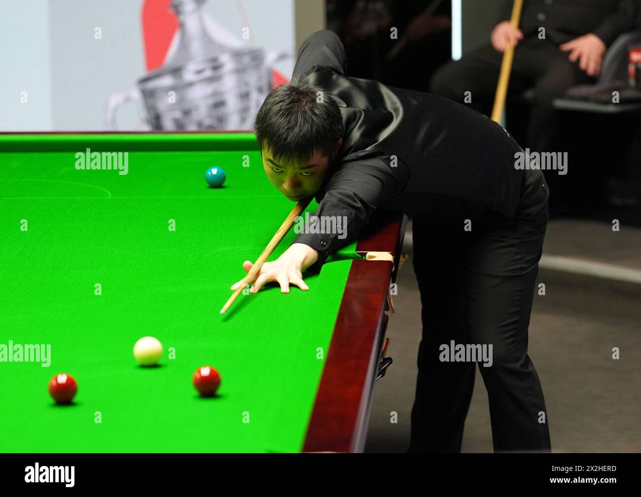 Pang Junxu in action against Robert Milkins on day three of the 2024 ...
