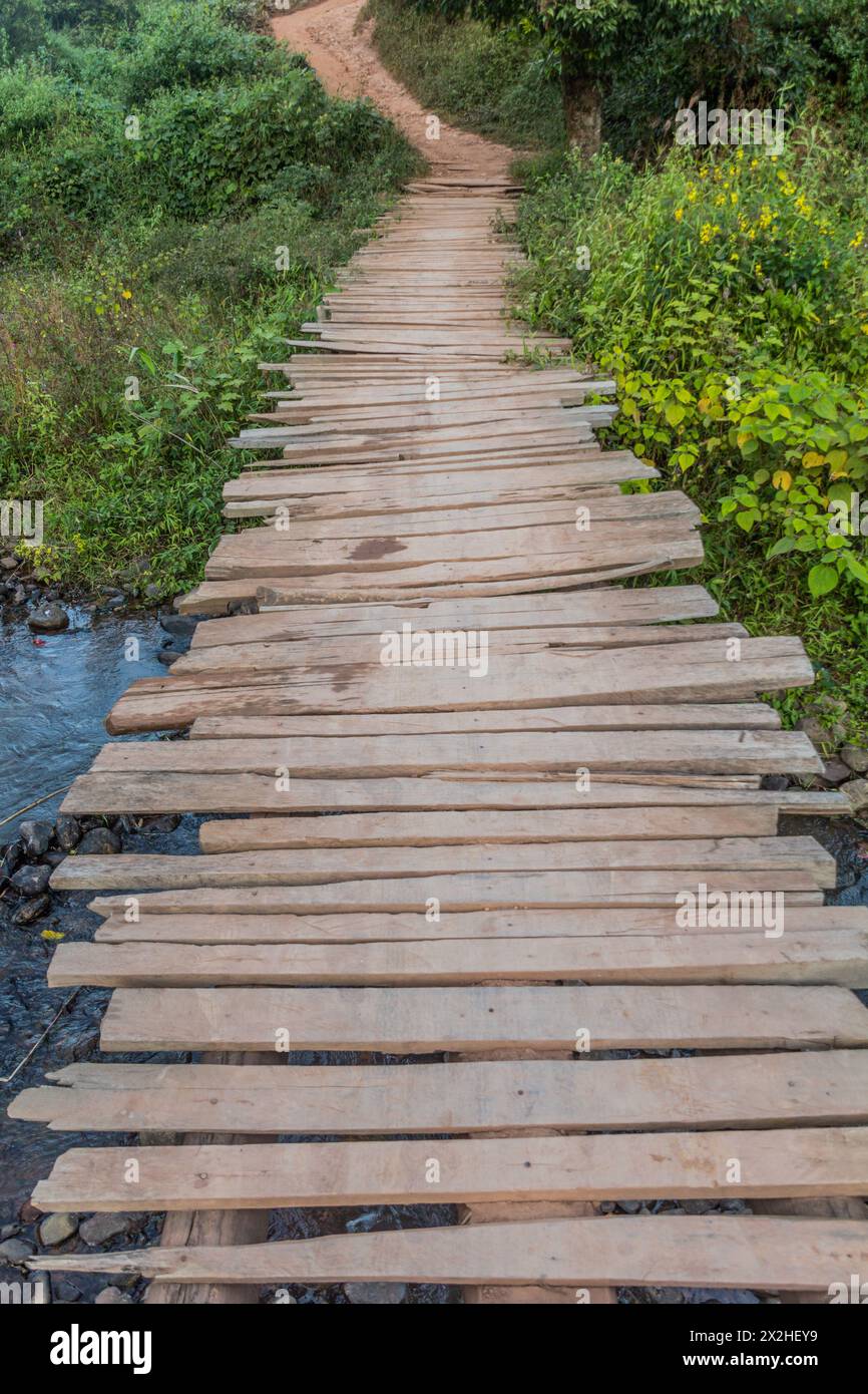 Foot bridge in Lakkham-Mai village near Luang Namtha, Laos Stock Photo ...