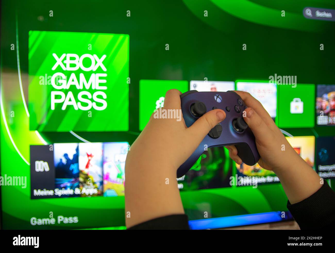 Joystick controller in the hand. Gaming consoles the Xbox Series X and ...