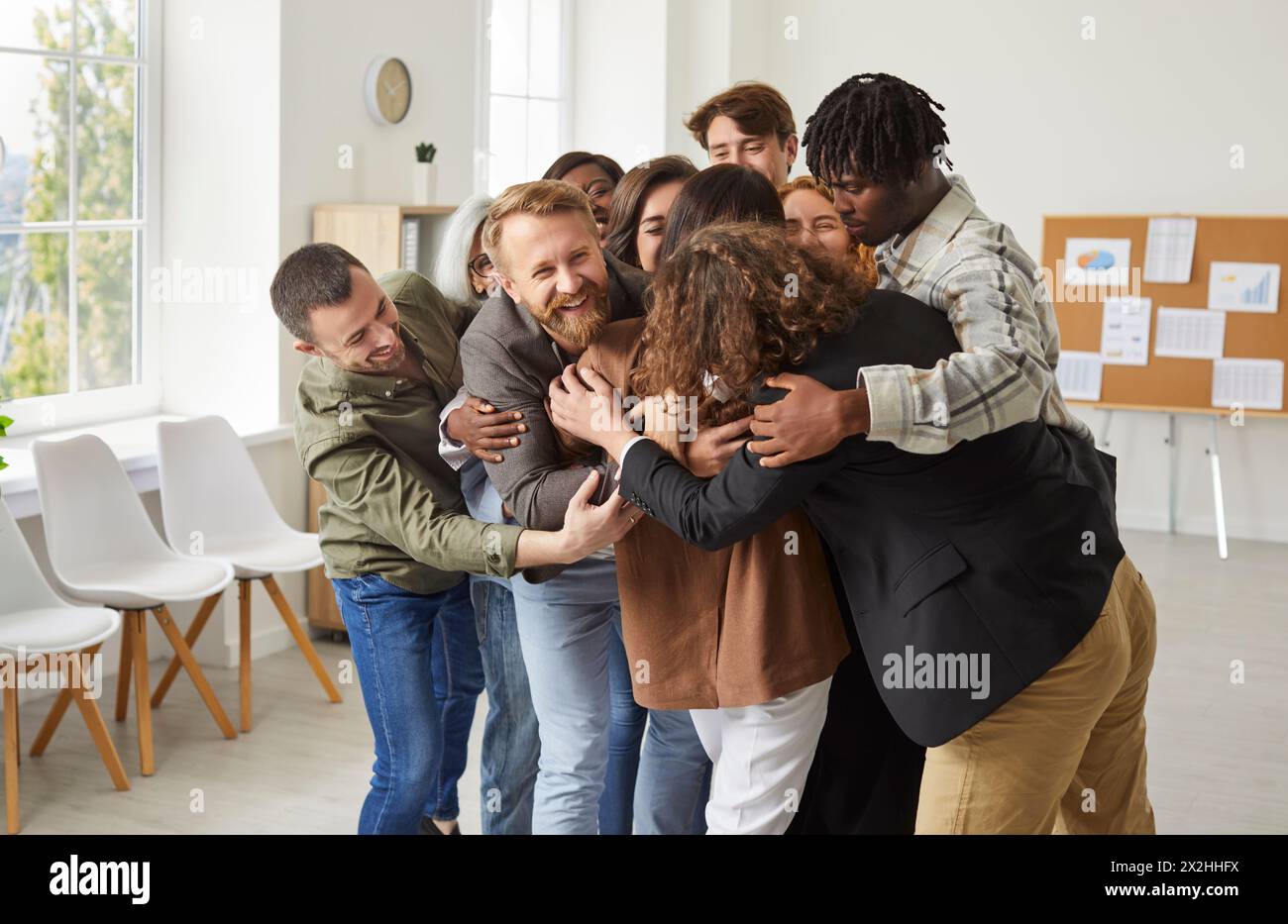 Team office collaboration embracing hi-res stock photography and images ...