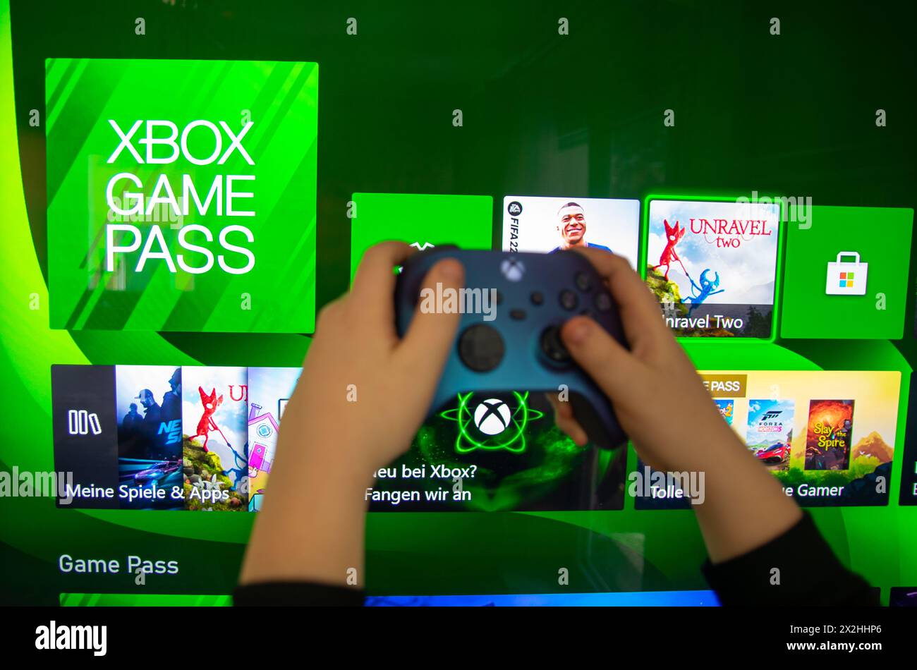 Joystick controller in the hand. Gaming consoles the Xbox Series X and ...