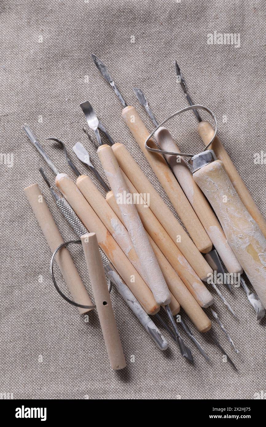 Set of different clay crafting tools on grey fabric, top view Stock ...