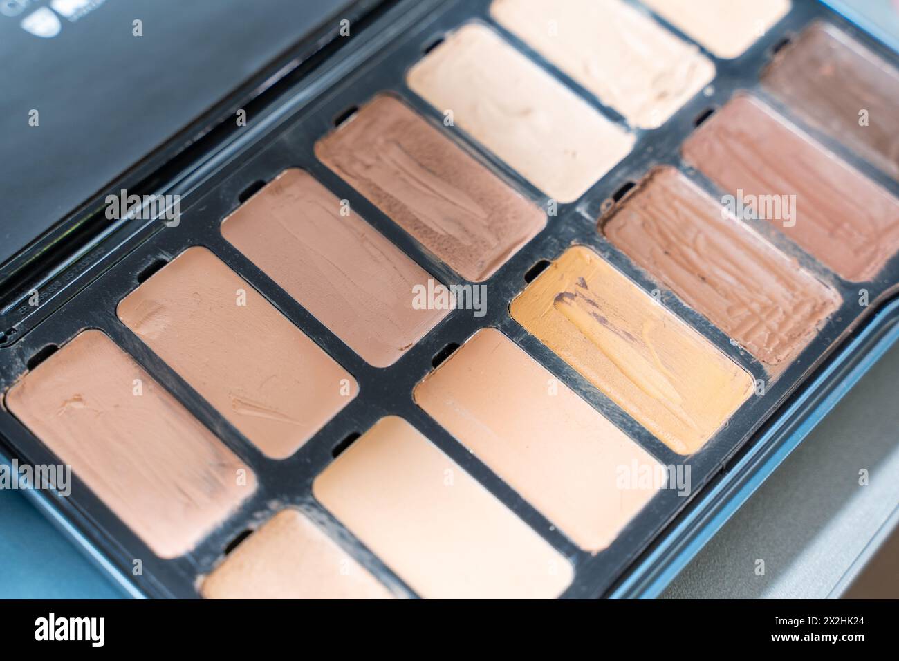 A palette of bases for makeup in beige tones. Close-up. Selected Focus ...