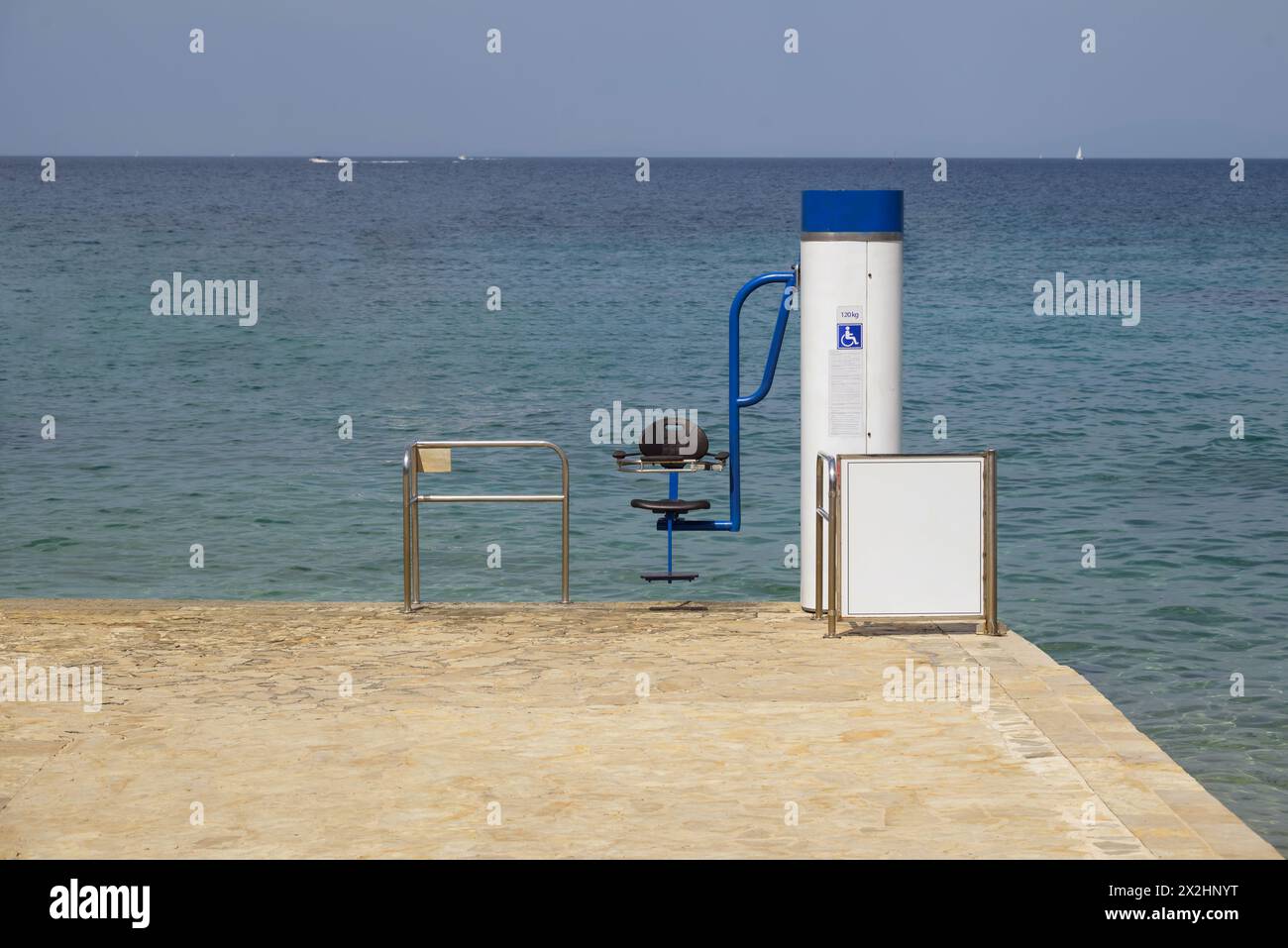 Swimming lift at sea for people with disability. Accessible beach and ...