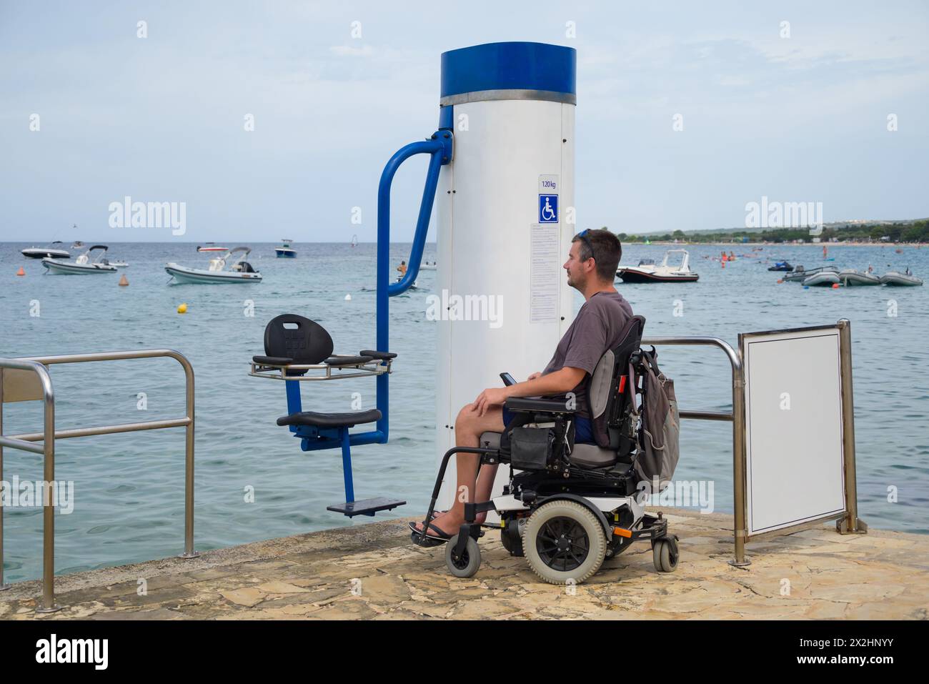 Swimming lift at sea for people with disability. Accessible beach and ...