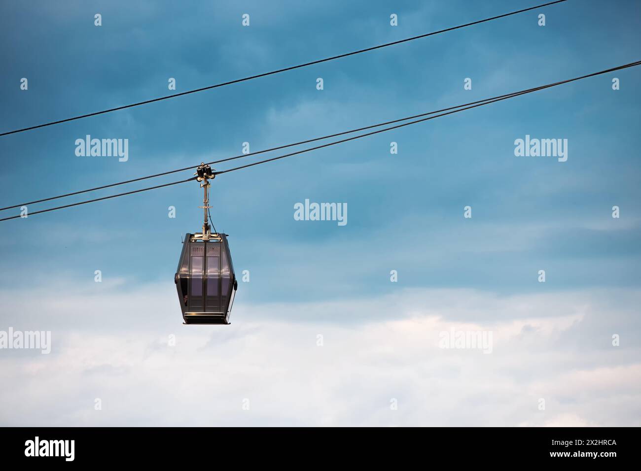 Suspended in the air, the gondola glides effortlessly along the steel ...