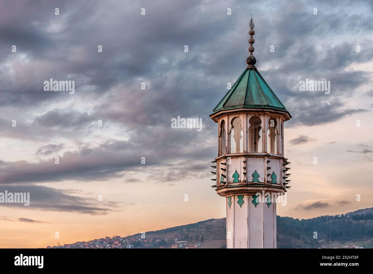 architectural marvels of Sarajevo's wooden mosque minarets, reflecting ...